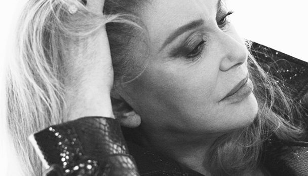 Catherine Deneuve Models the Classic SAINT LAURENT Trench Coat